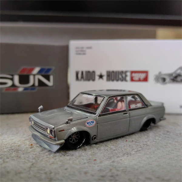 (Поставляется с защитной оболочкой)Машинка KAIDO HOUSE Mini Gt 1/64 ...