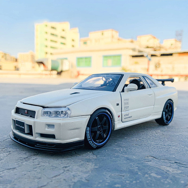 Машинка Maisto 1:24 Nissan Skyline R34 GT-R открывающиеся двери, вращающиеся резиновые колеса ...